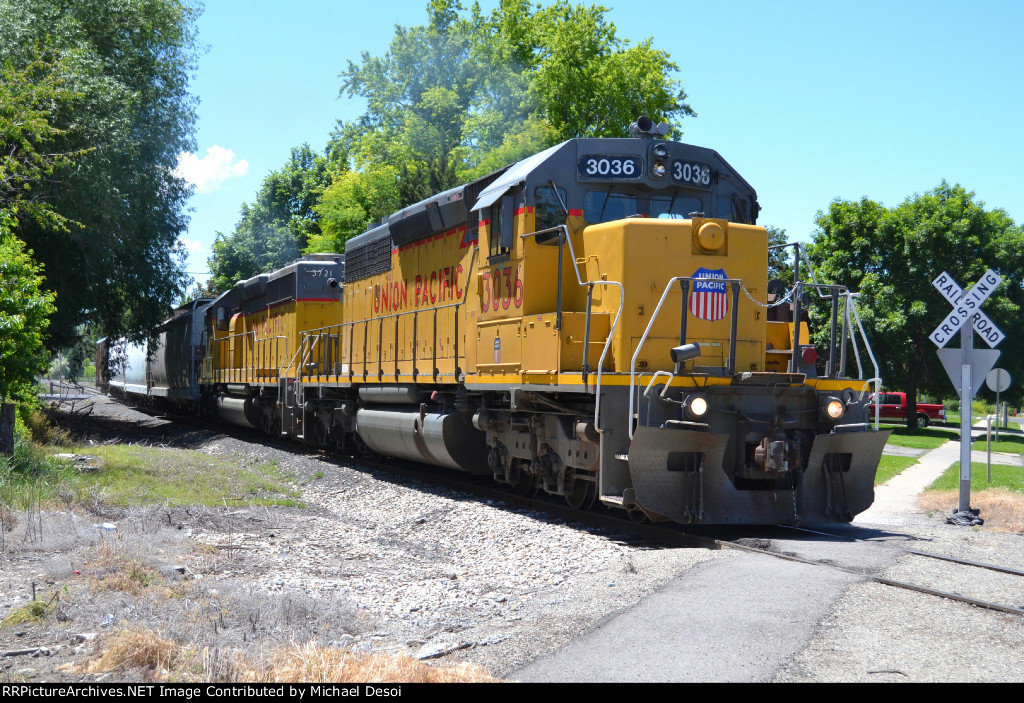 UP SD-40-2 #3036 (ex CNW, with nose gong) prepares to cross S 600 W with the northbound Cache ...